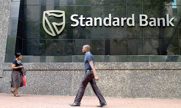 Standard Bank sees full-year earnings rising as much as 35 percent ...